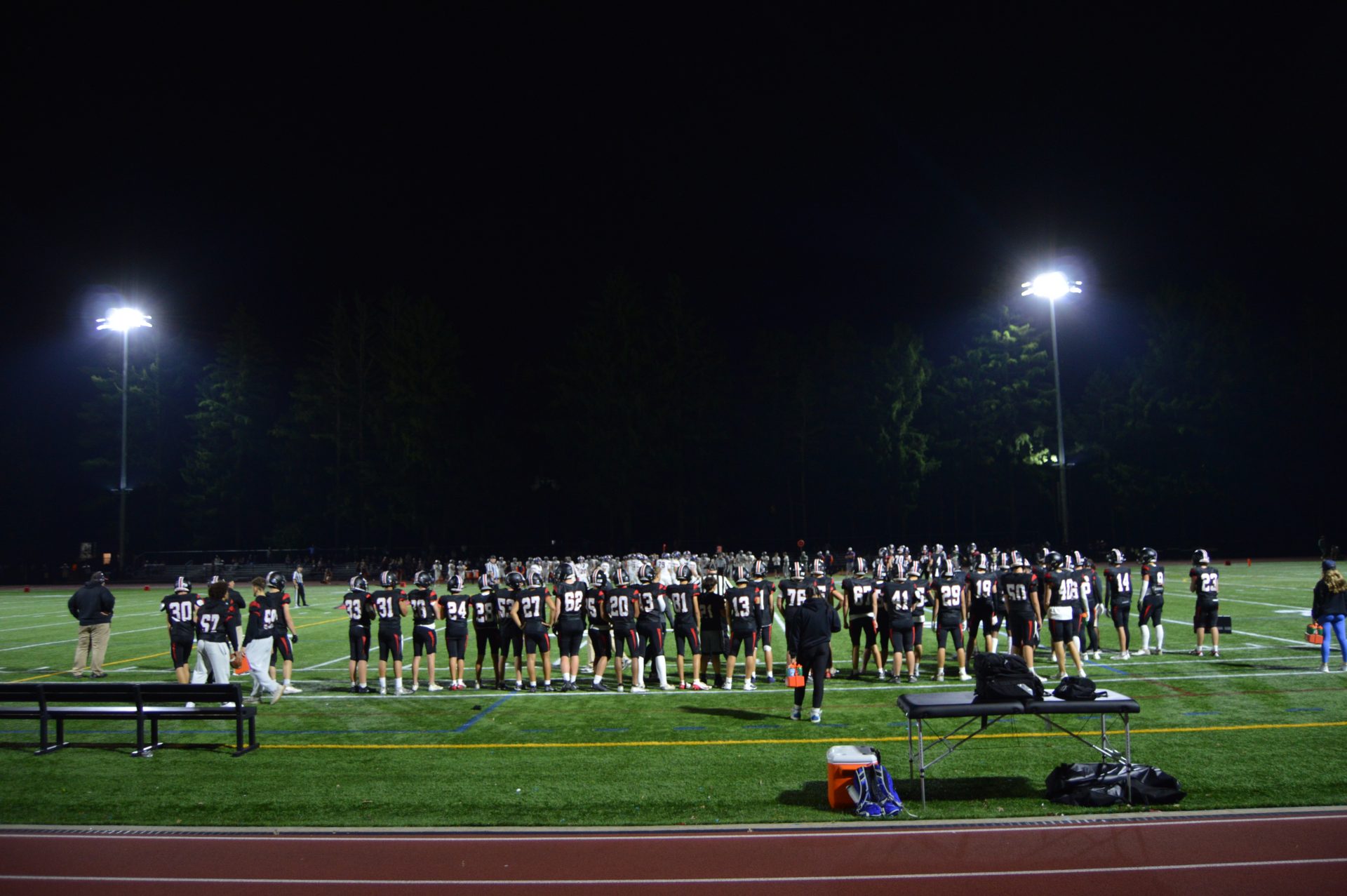 Wellesley High Raiders light up Walpole in dramatic nighttime football ...